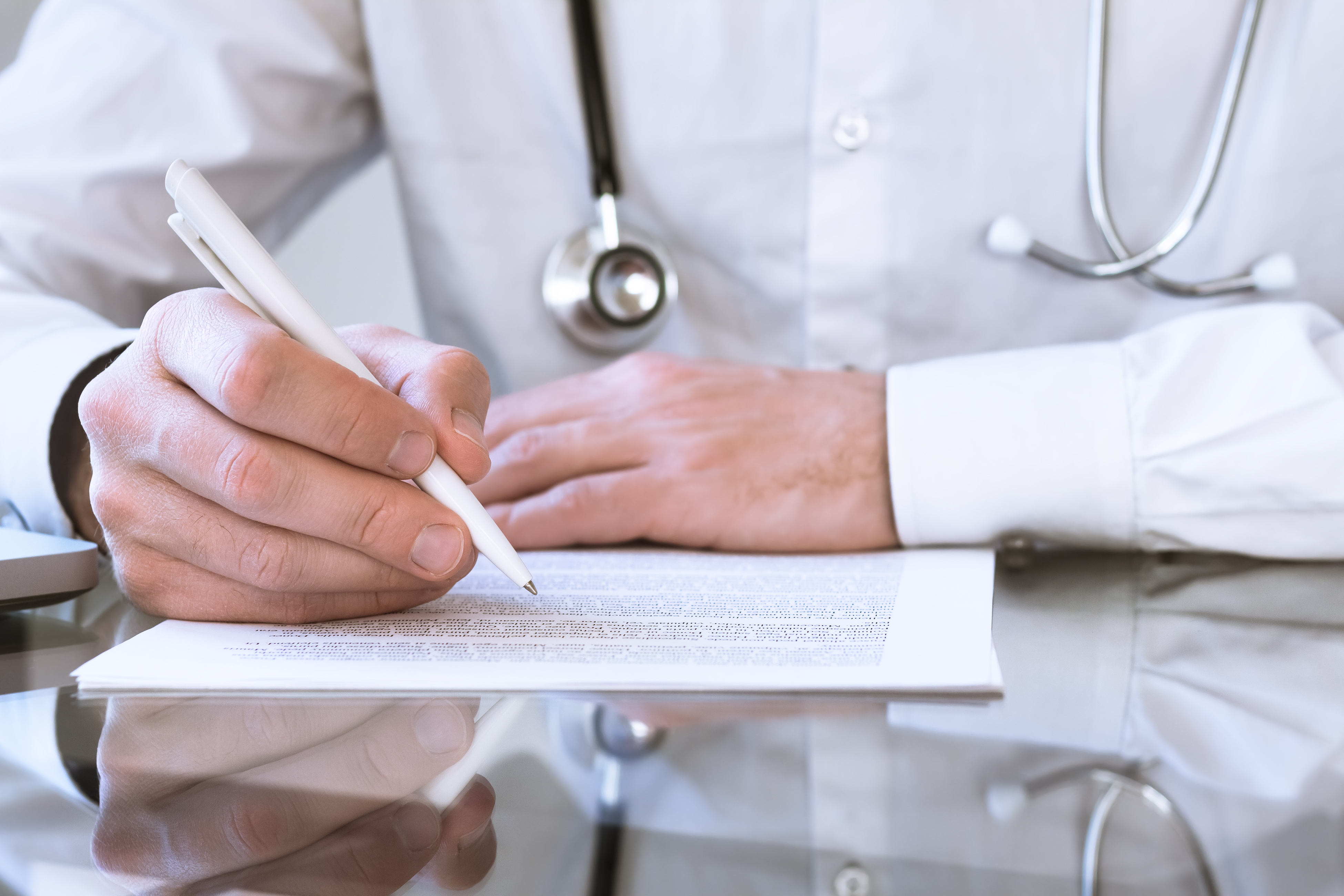 Male Doctor Writing Medical Prescription Or Certificate Orb Health